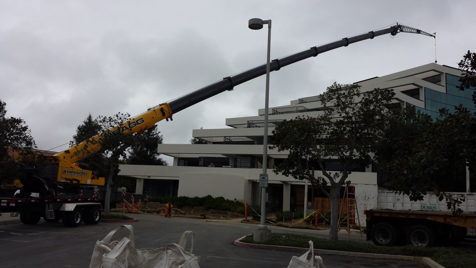 Commercial Roofing Crane Truck Placing Materials - Sylvester Roofing